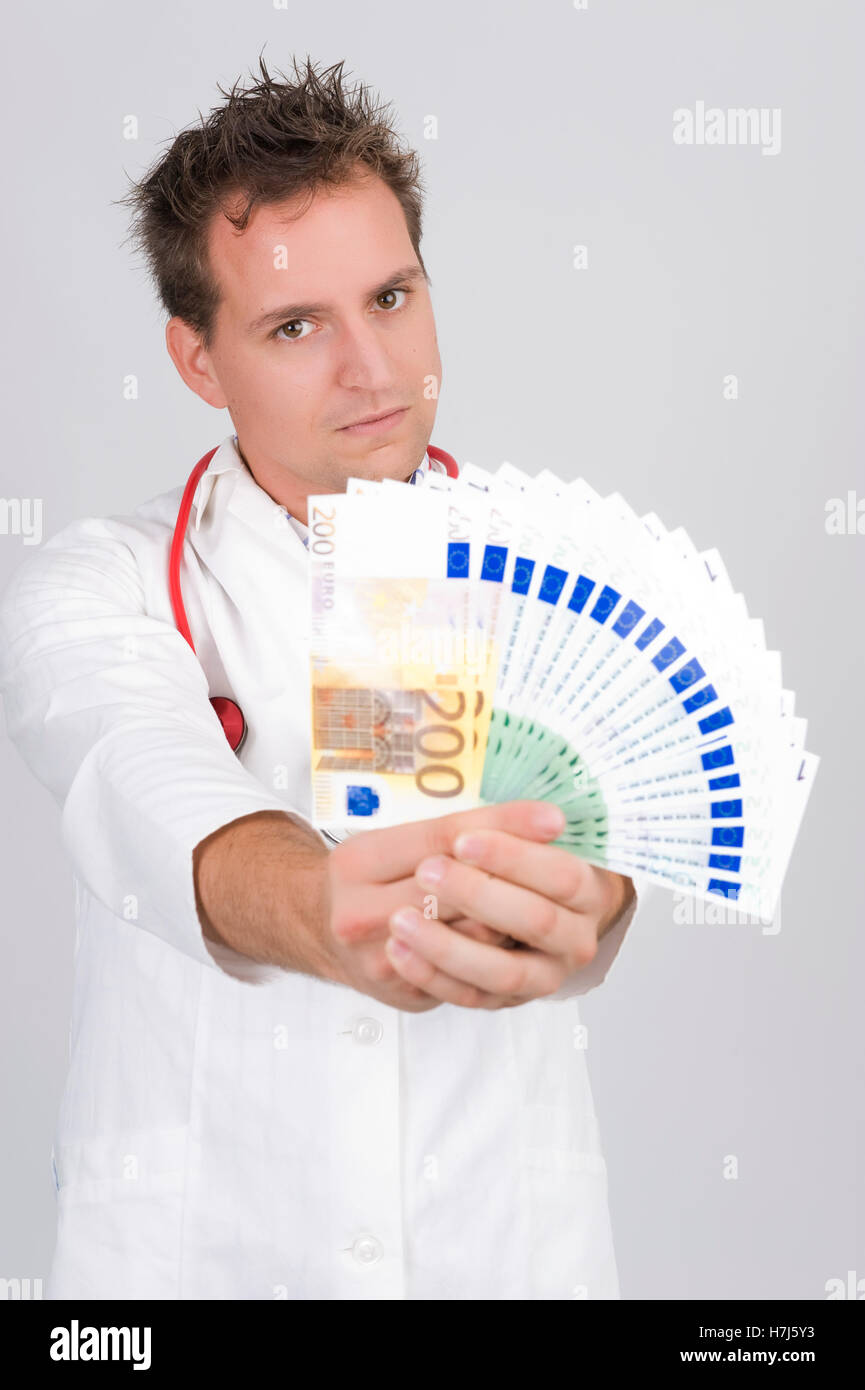 Bank notes and cut out business man hi-res stock photography and images ...