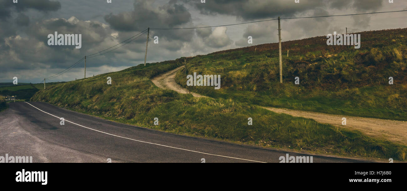 A country road winds it's way through a beautiful southern Irish ...