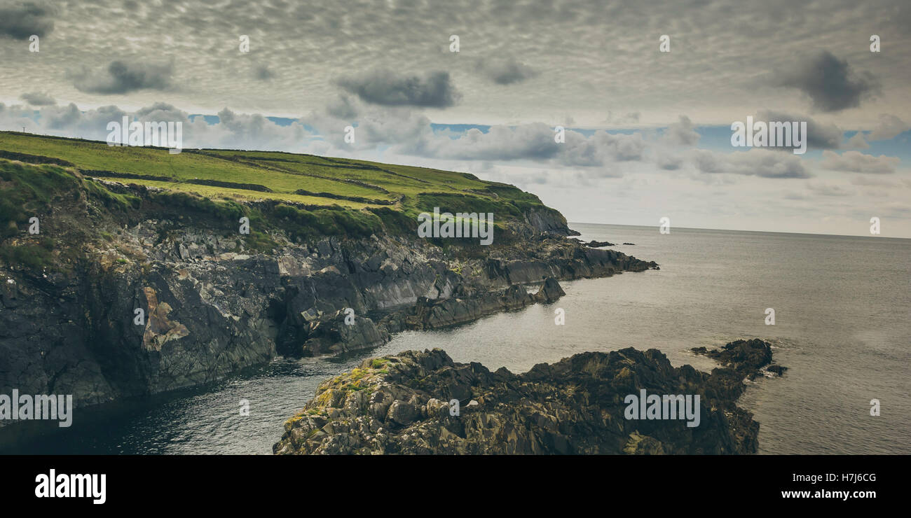 Jagged rocks at an outcrop near Galley Head that reaches out to the sea ...