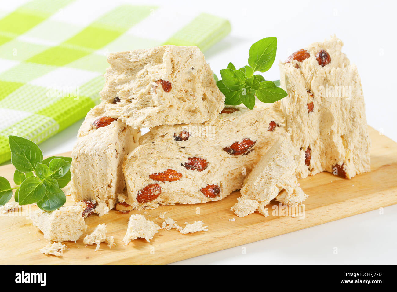 Pieces of Greek halva with almonds Stock Photo - Alamy