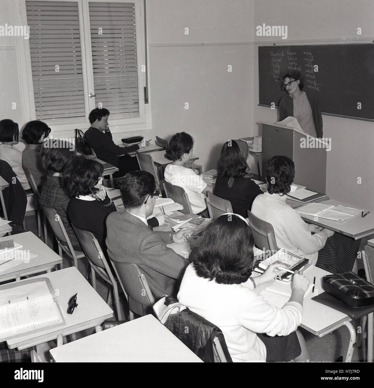 1960s, historical, Group of young greek students in a classroom being ...