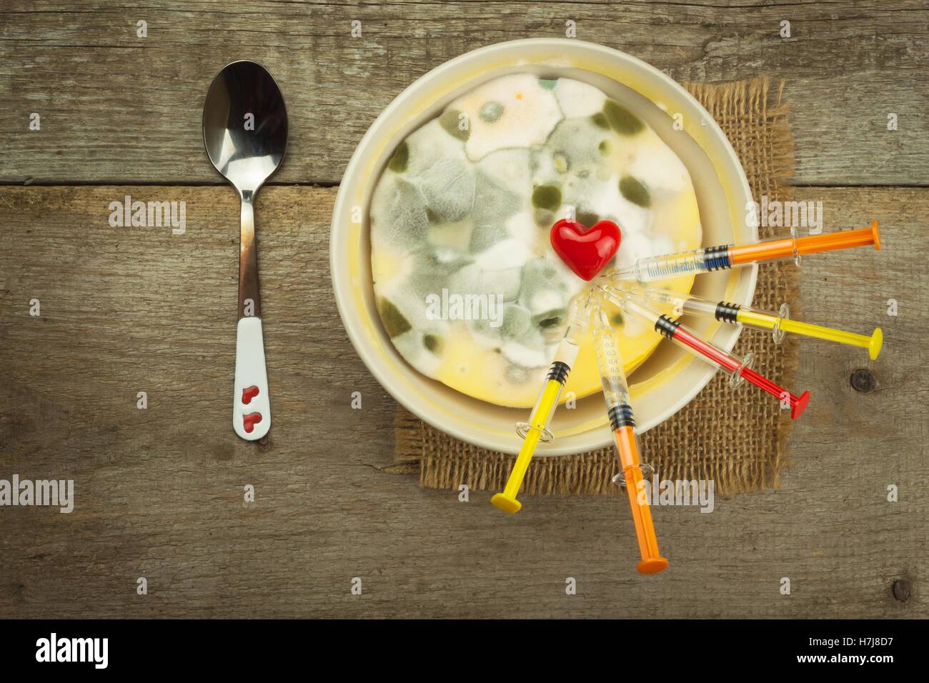 Moldy pudding and syringe. Treatment of the disease. Mold and ...