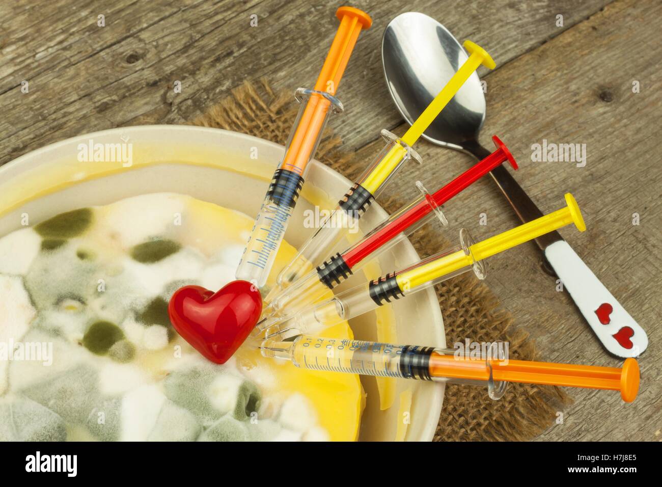 Moldy pudding and syringe. Treatment of the disease. Mold and ...