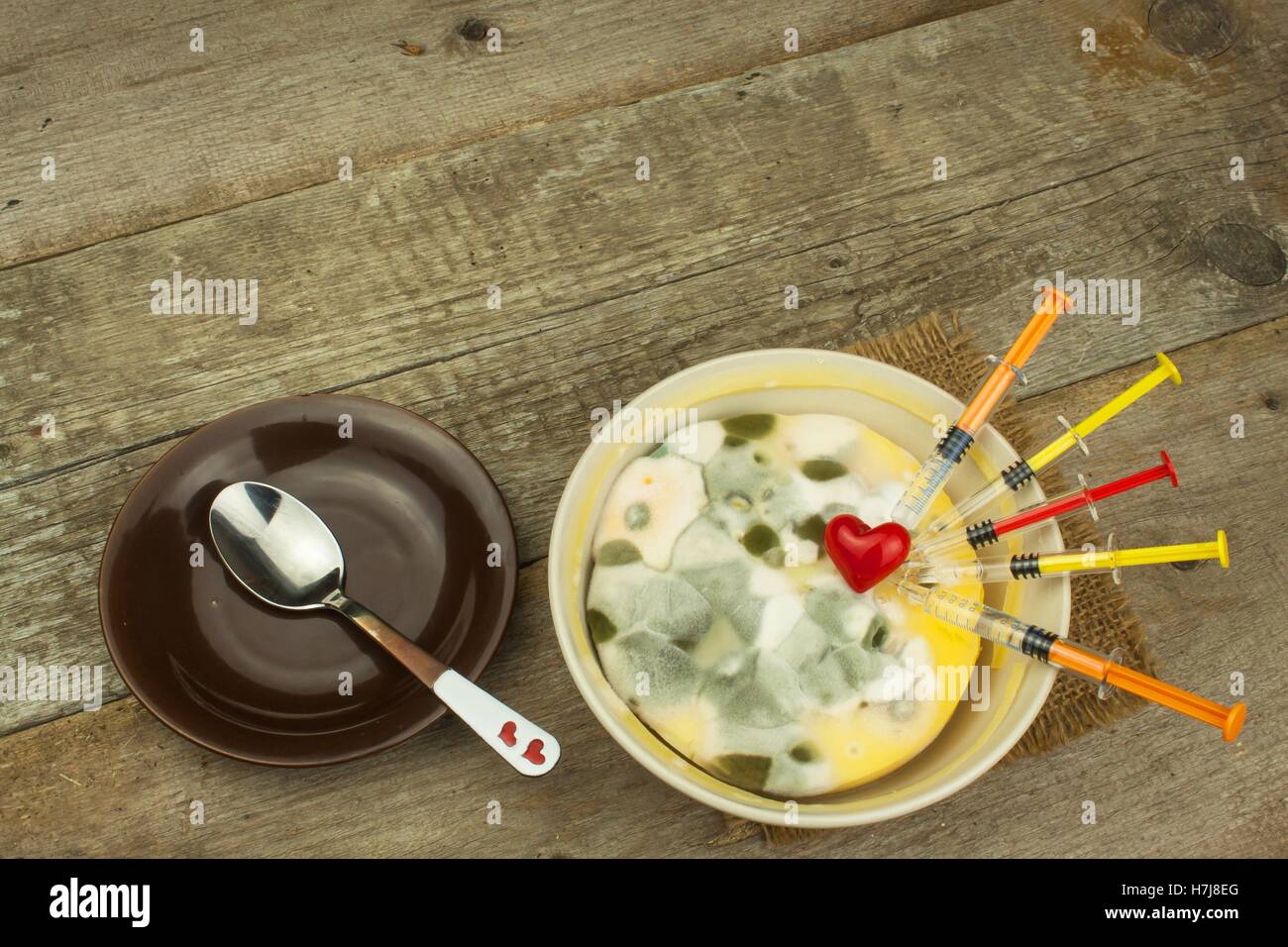 Moldy pudding and syringe. Treatment of the disease. Mold and ...