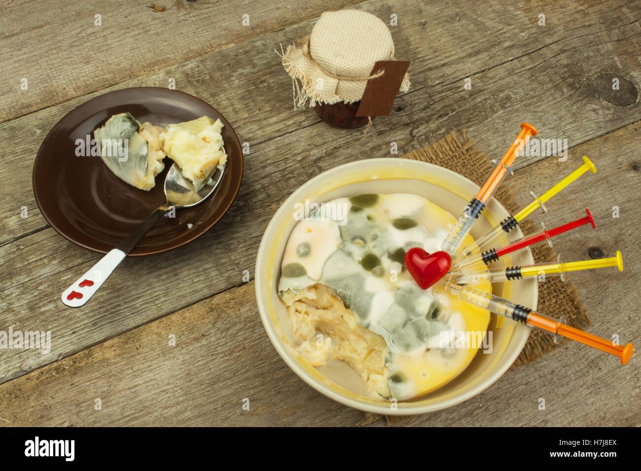 Moldy pudding and syringe. Treatment of the disease. Mold and ...