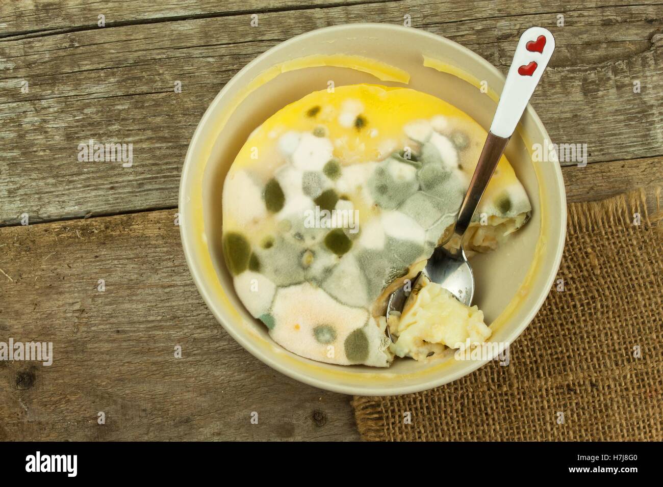 Moldy pudding. Poisonous food full of mold. Unhealthy food. Spores of ...