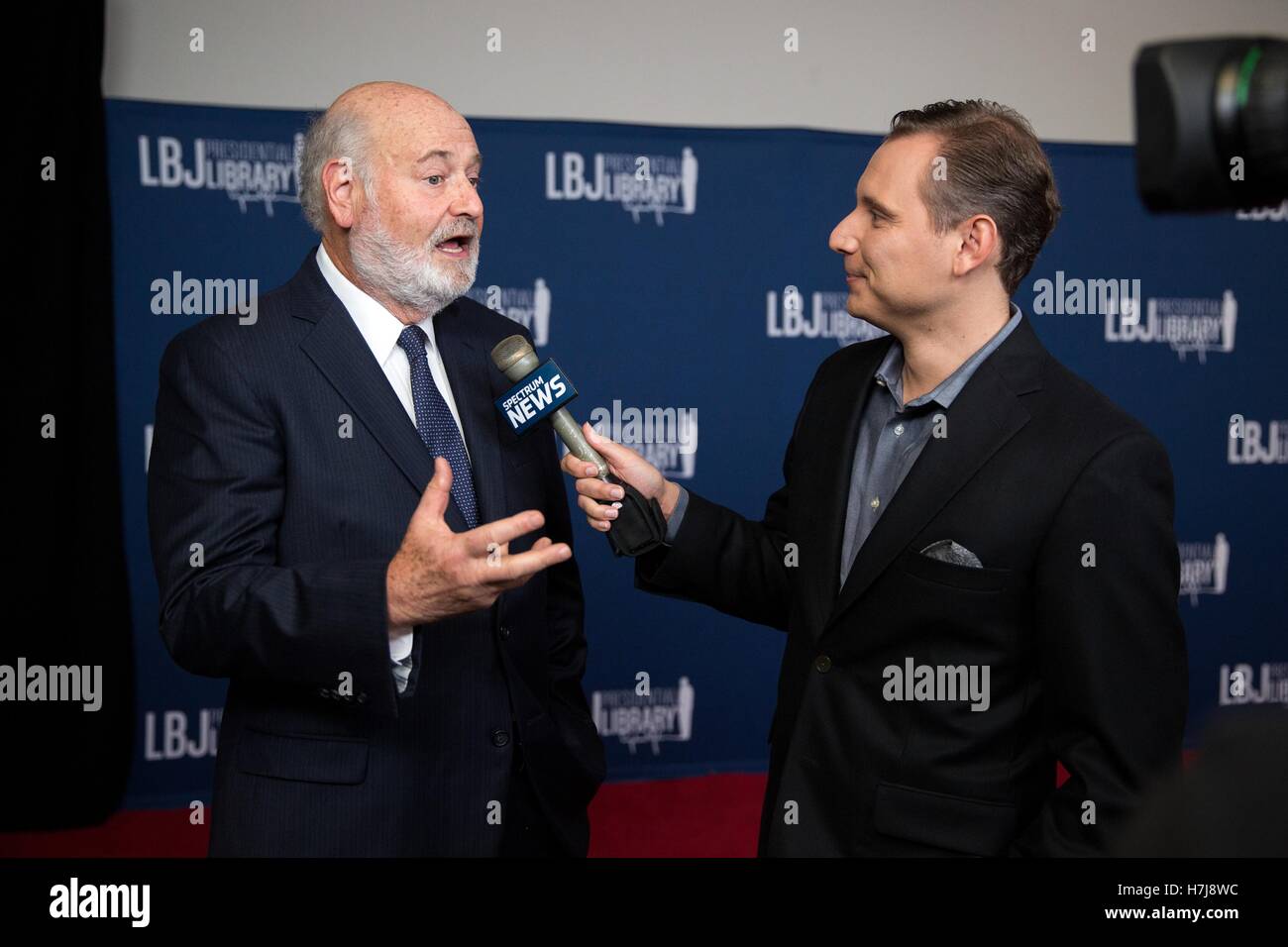 Director Rob Reiner (left) speaks with a reporter on the red carpet ...