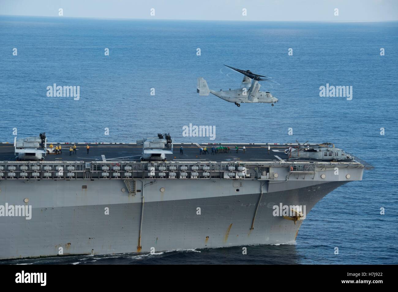 An MV-22B Osprey aircraft launches from the flight deck of the USN Wasp ...