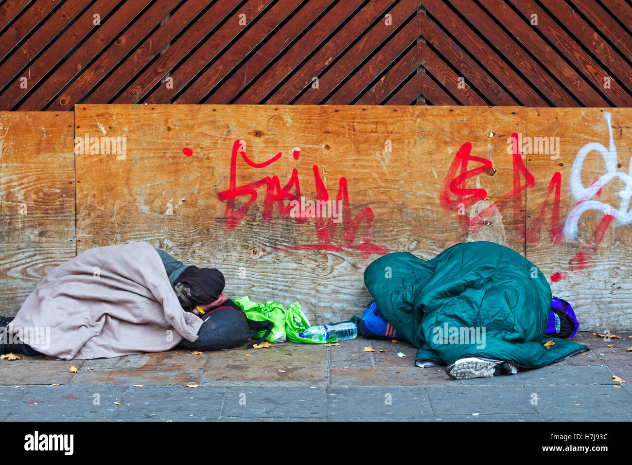 Two homeless people sleeping out on the streets of Liverpool UK Stock ...