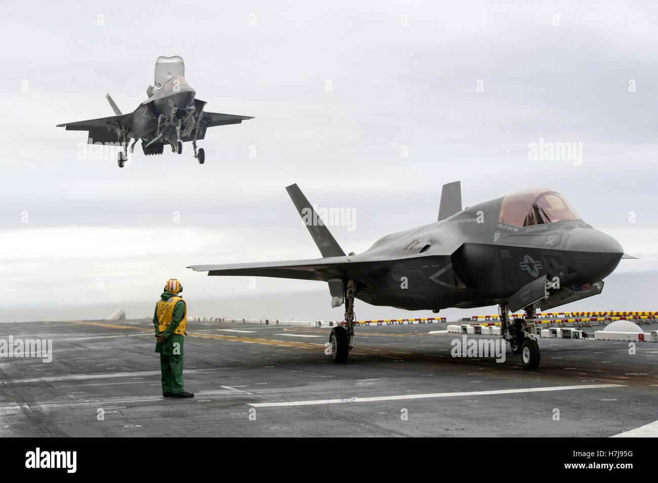 F-35B Lightning II stealth fighter aircraft perform a vertical landing ...