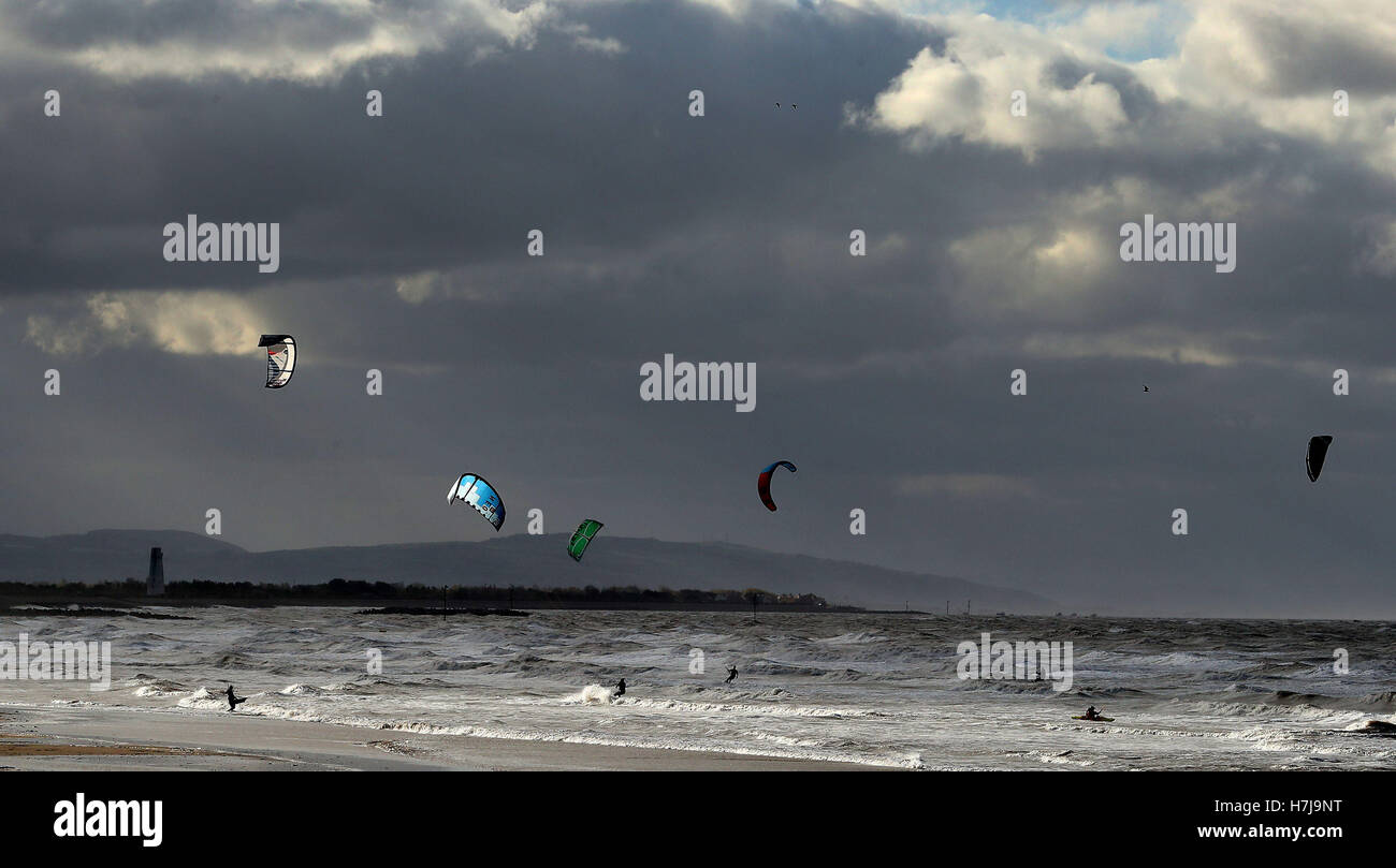 Kite surfers enjoy the strong wings and rough River Mersey waves on the ...