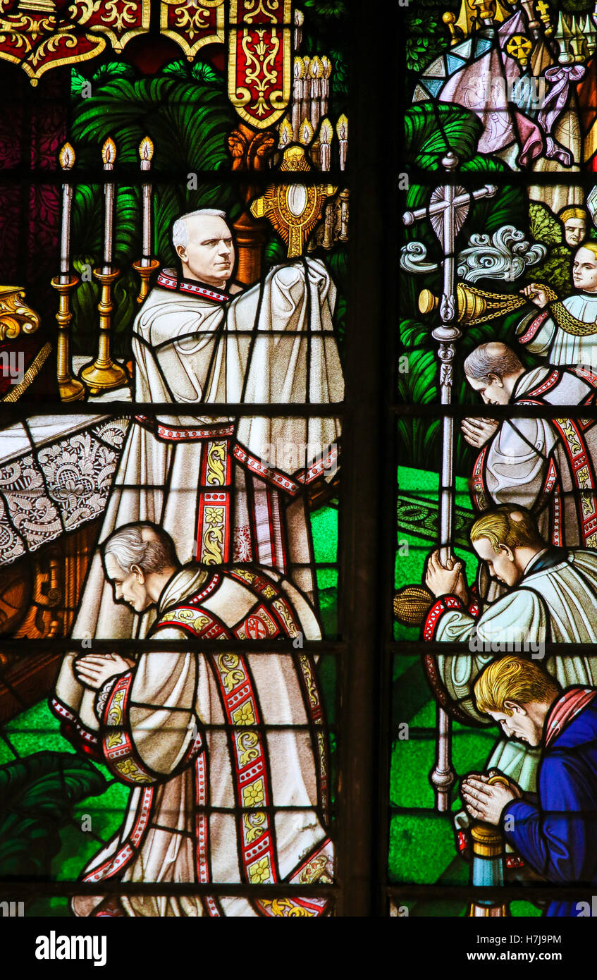 Stained Glass window depicting a bishop holding the Monstrance, the ...