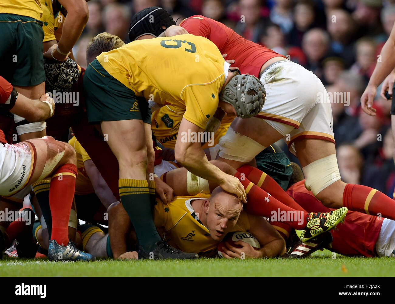 Australia's Stephen Moore (bottom) scores his team's first try during ...