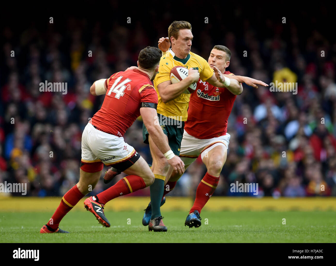 Australia's Dane Haylett-Petty (centre) is tackled by Wales' Alex ...