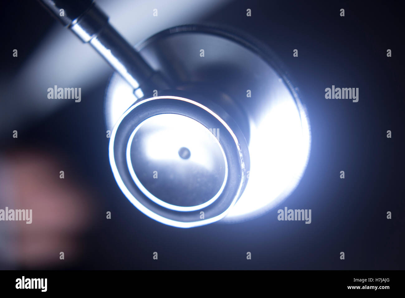 Medical doctor's stethoscope used to listen to patient heart rate ...