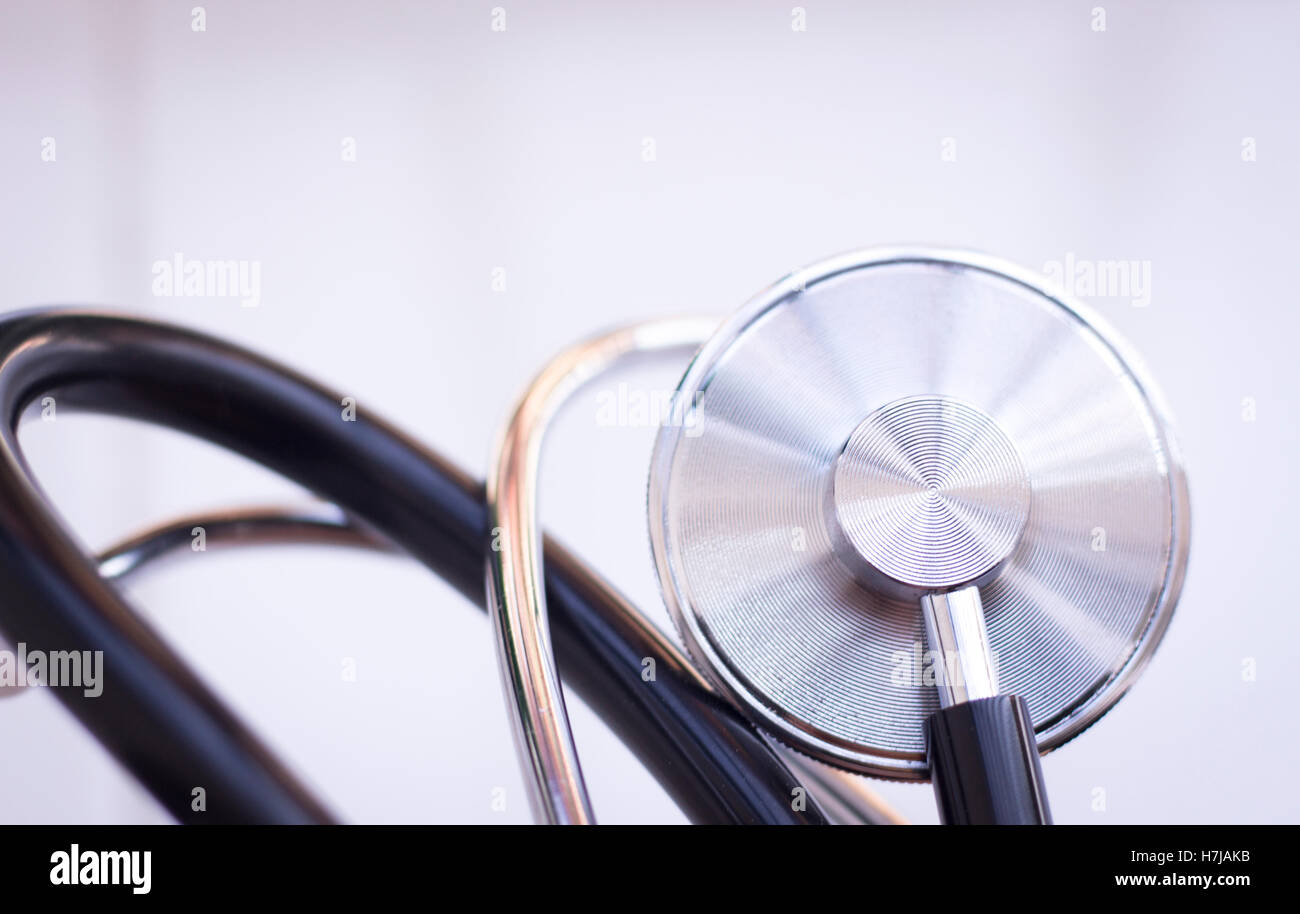Medical doctor's stethoscope used to listen to patient heart rate ...