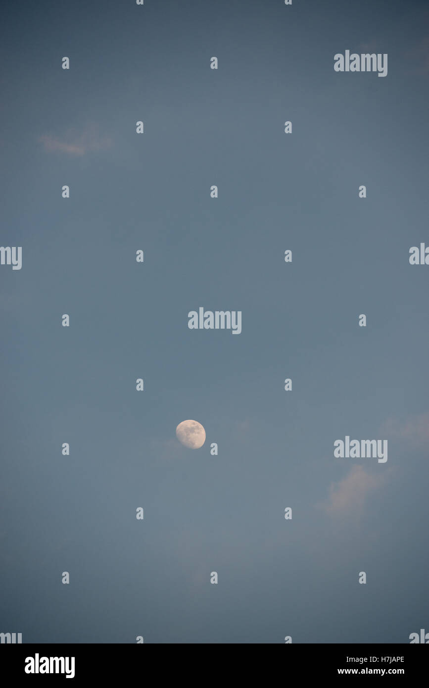 full moon background at the dusk on cloudy sky Stock Photo - Alamy