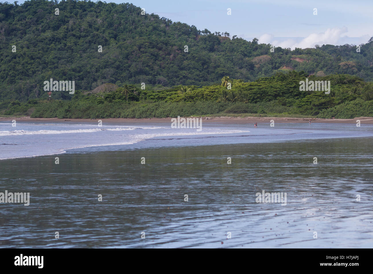 Tambor, Costa Rica - June 22: clam day at the beach with people walking ...