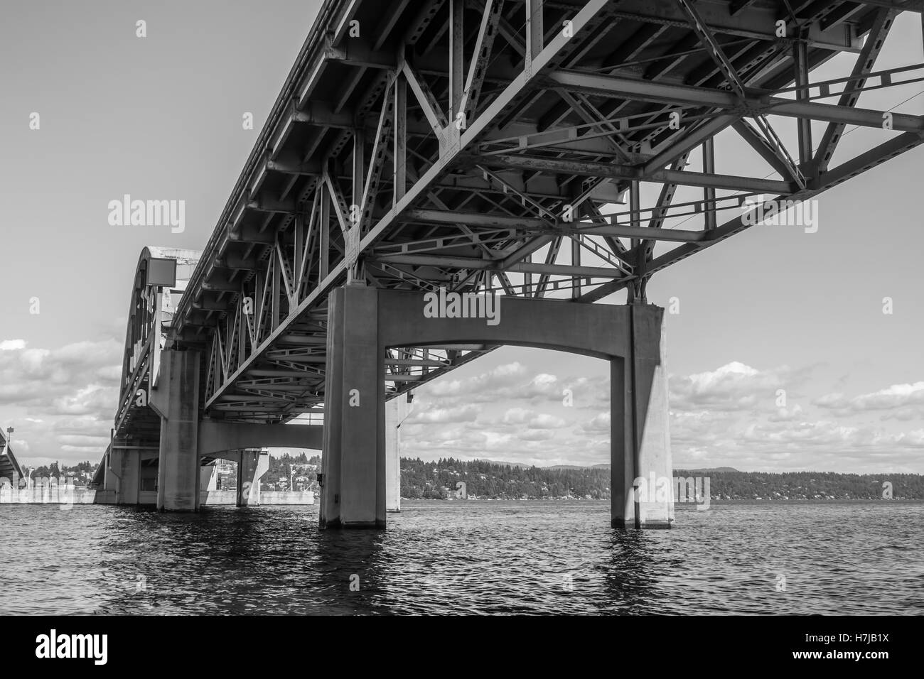 A view from under the I-90 bridge in Seattle, Washington. Black and ...