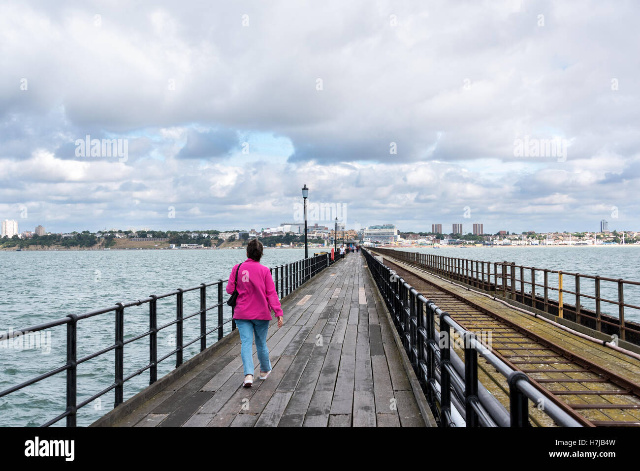 Woman walk sunny pier hi-res stock photography and images - Alamy