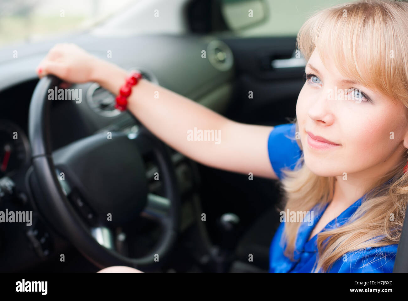 attractive blonde woman driver Stock Photo - Alamy