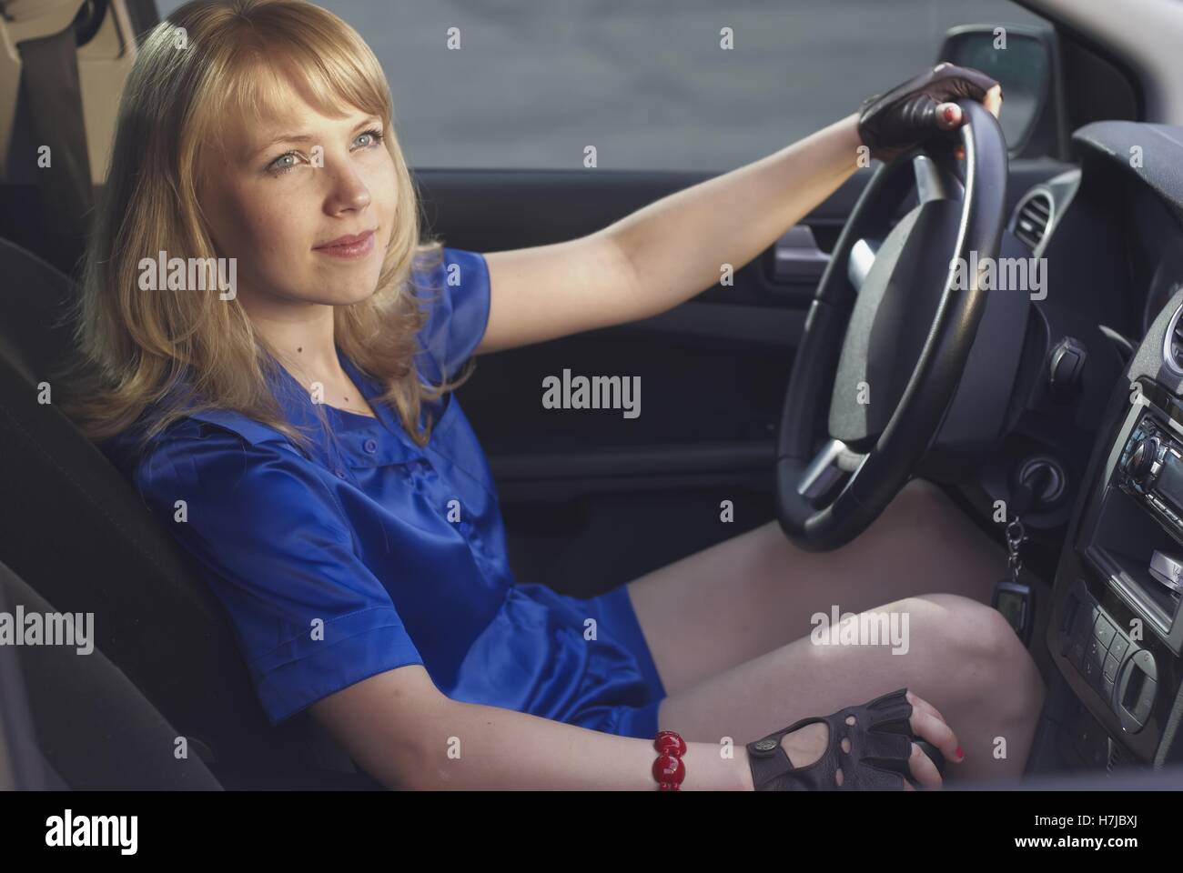 Girl driving a car Stock Photo - Alamy