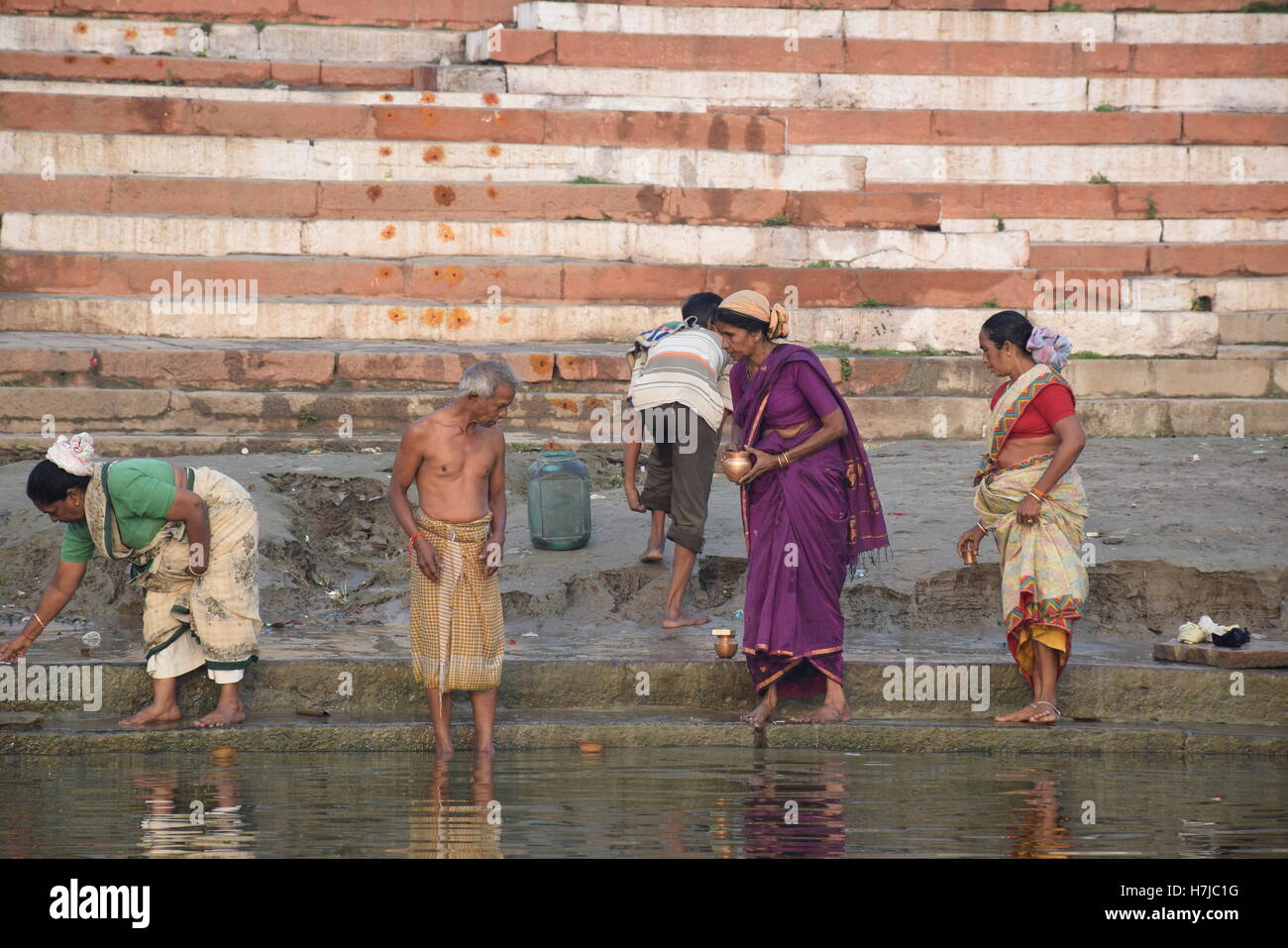 Indian people having bath in hi-res stock photography and images - Alamy