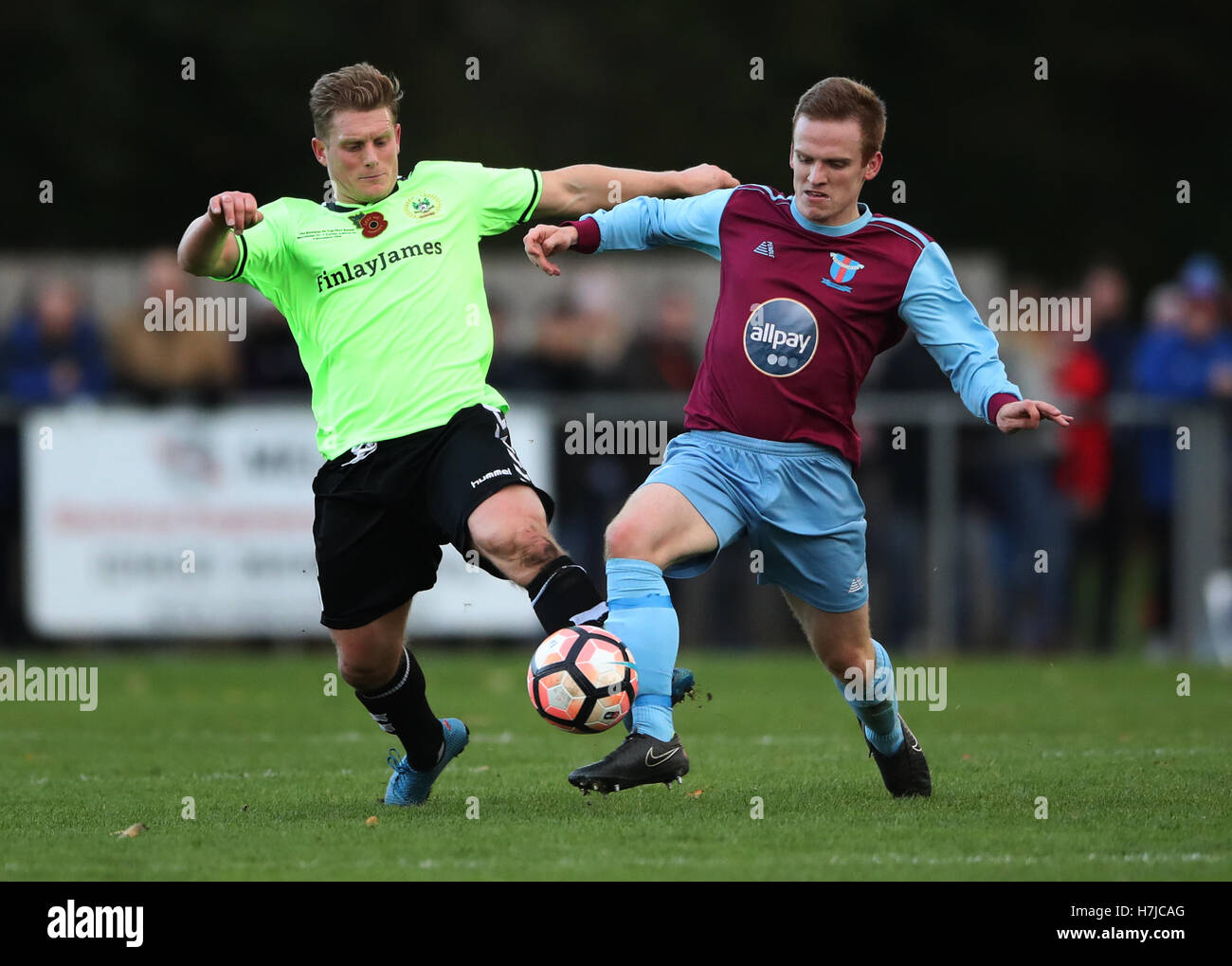 Westfields' Matt Reeve and Curzon Ashton's Iain Howard (left) battle ...