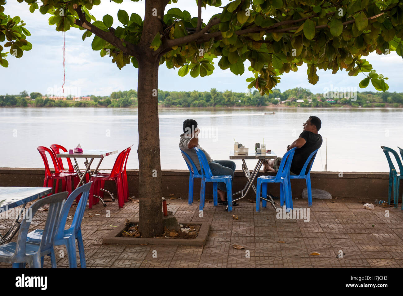 Locals relaxing by the side of the Mekong River in Stung Treng, the ...