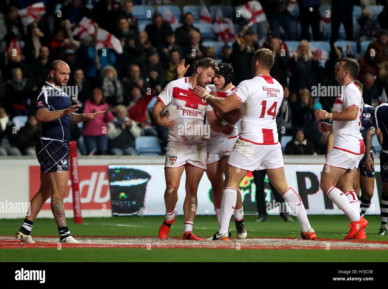 England's Elliott Whitehead (second left) celebrates scoring his side's ...