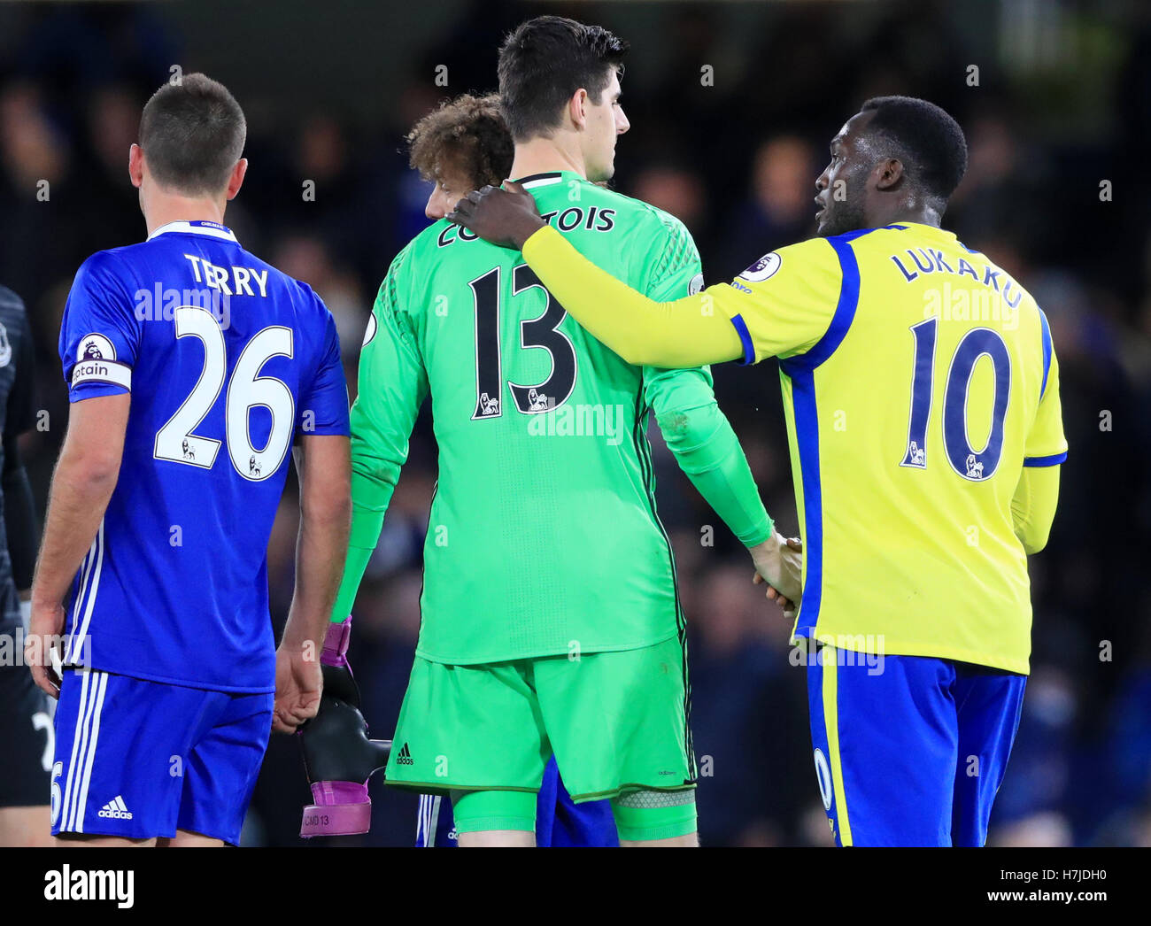 Chelsea goalkeeper Thibaut Courtois and Everton's Romelu Lukaku react ...