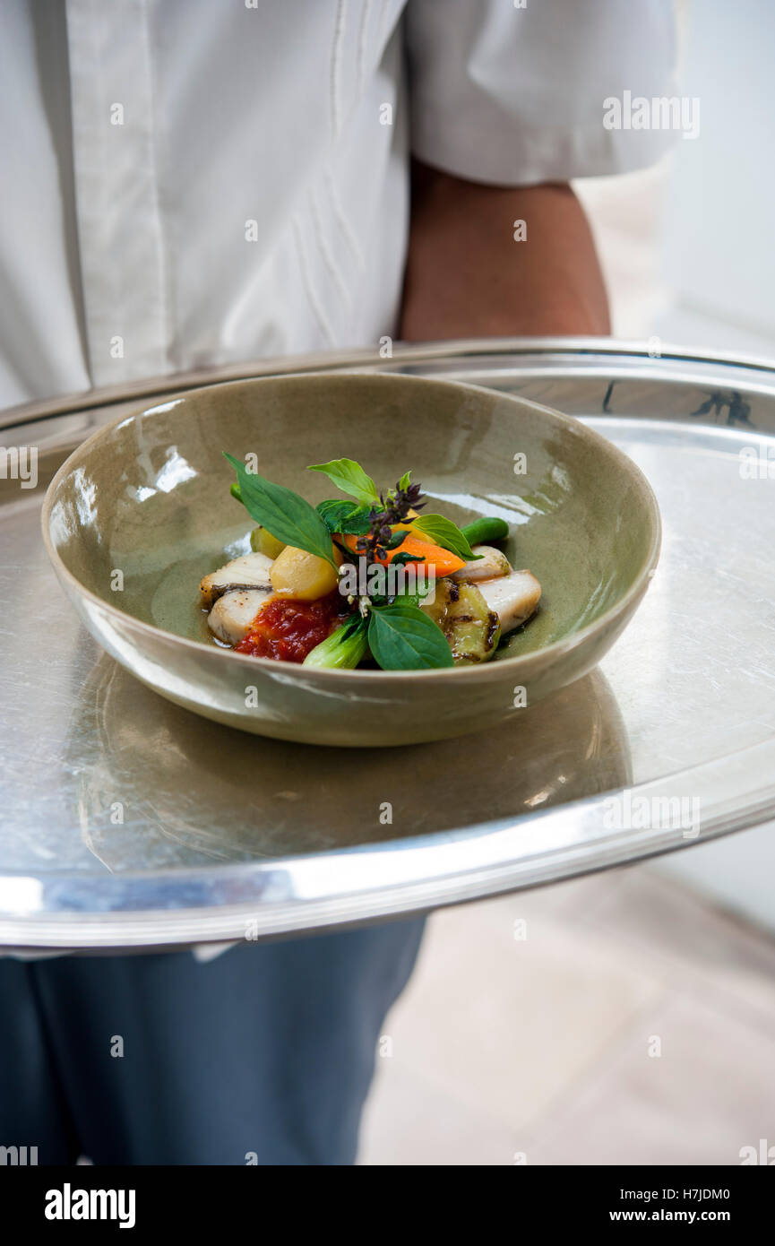 Baked sea bass with ginger leaf, local young vegetables and spicy ...