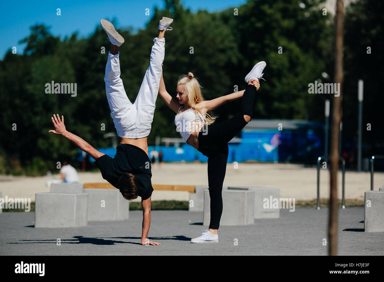 man and woman performing tricks Stock Photo - Alamy