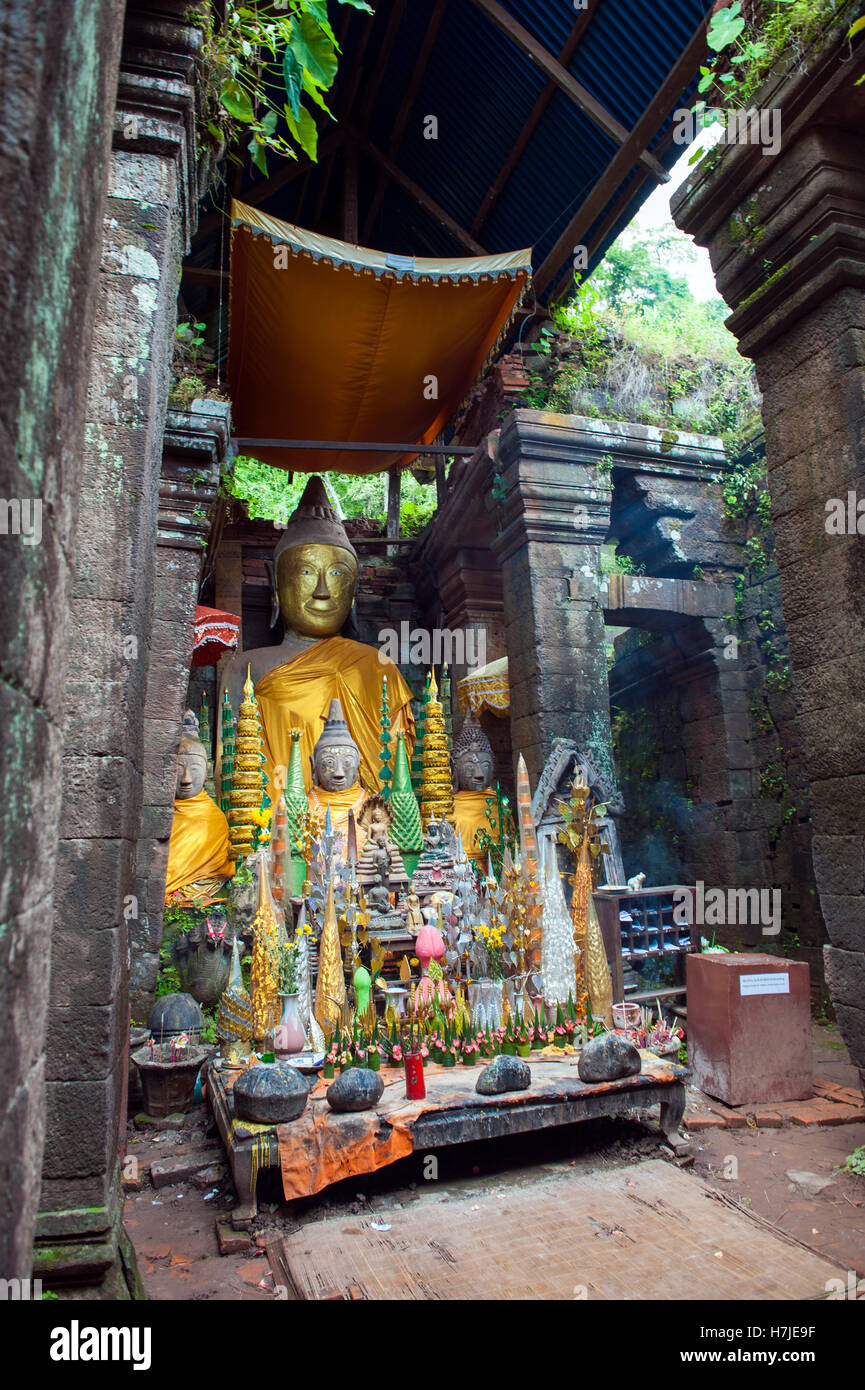 A Buddhist shrine inside Wat Phu, a ruined Khmer Hindu temple complex ...