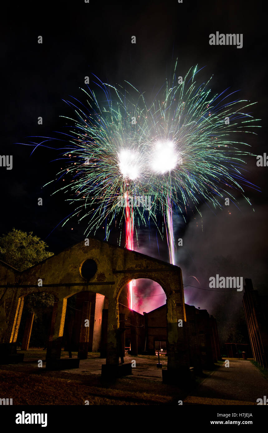 fireworks sparkle colorful in the dark night over the ancient ruins ...