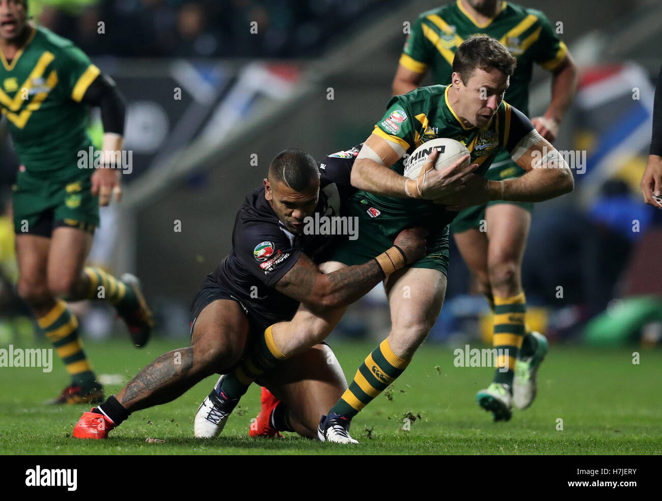 Australia's James Maloney is tackled by New Zealand's Manu Ma'u during ...