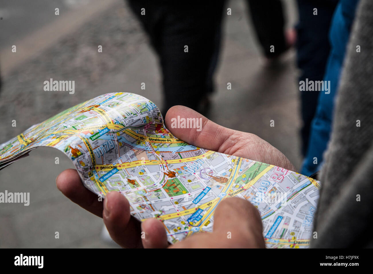 Consulting a map Stock Photo - Alamy
