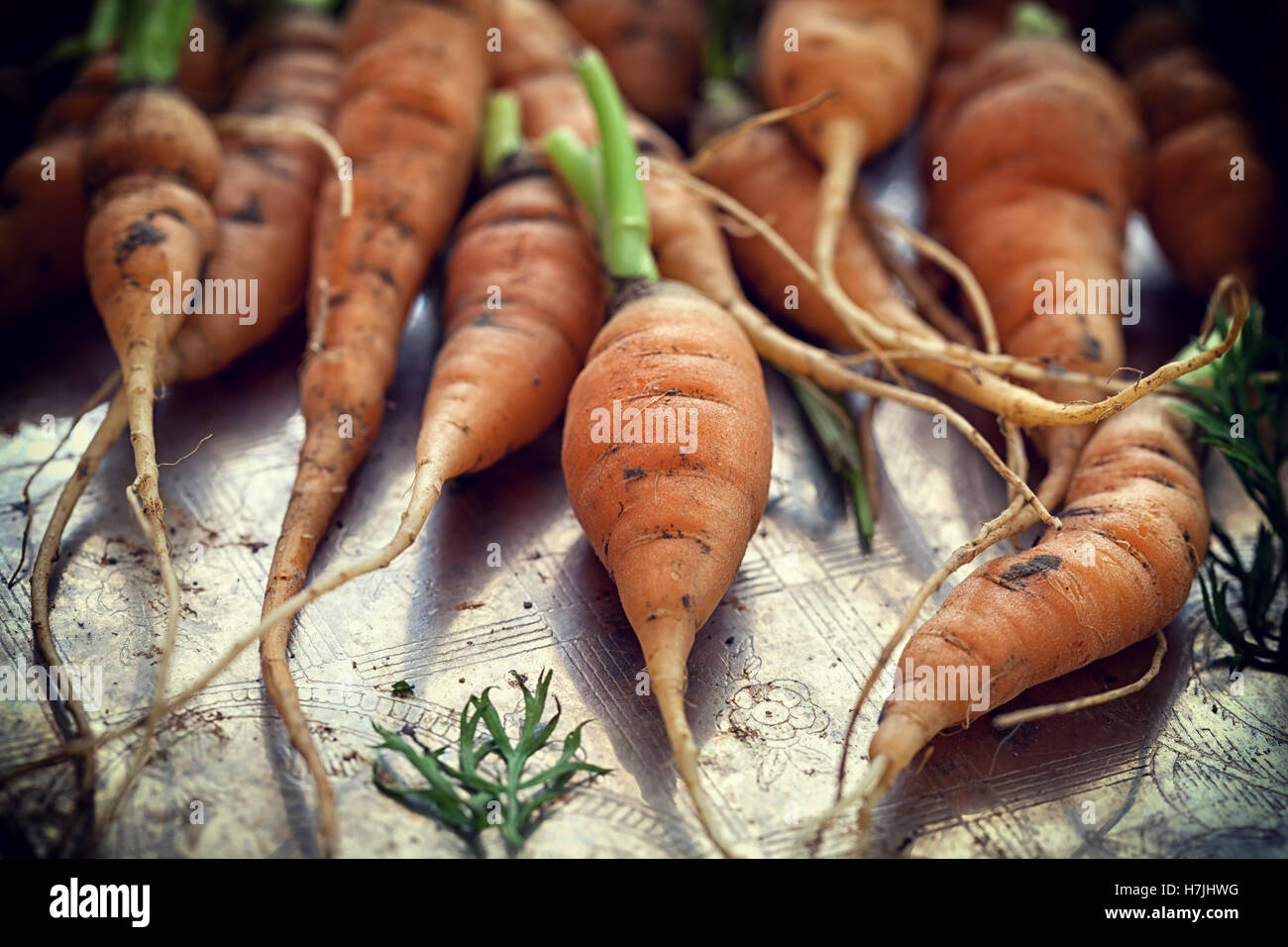 Organic carrots on wooden table Stock Photo - Alamy