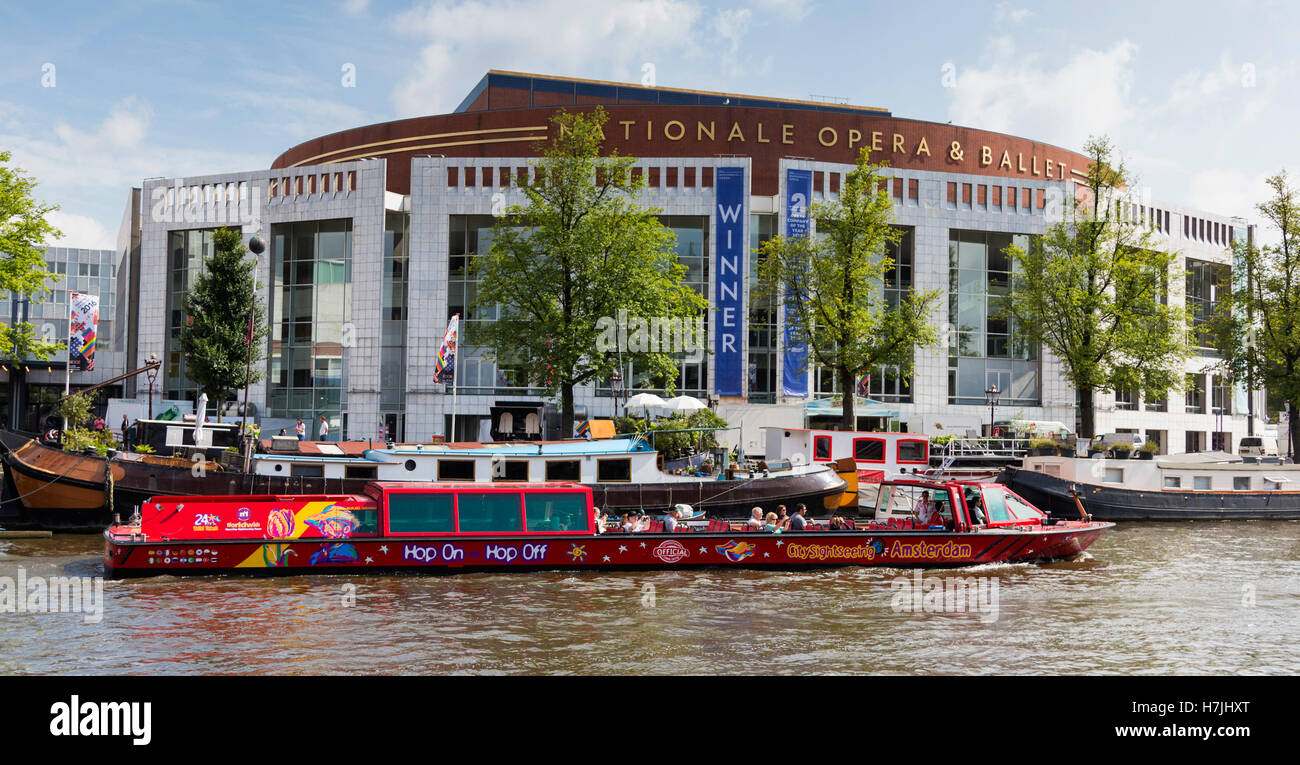 Nationale Opera and Ballet house in Amsterdam with sightseeing boat ...