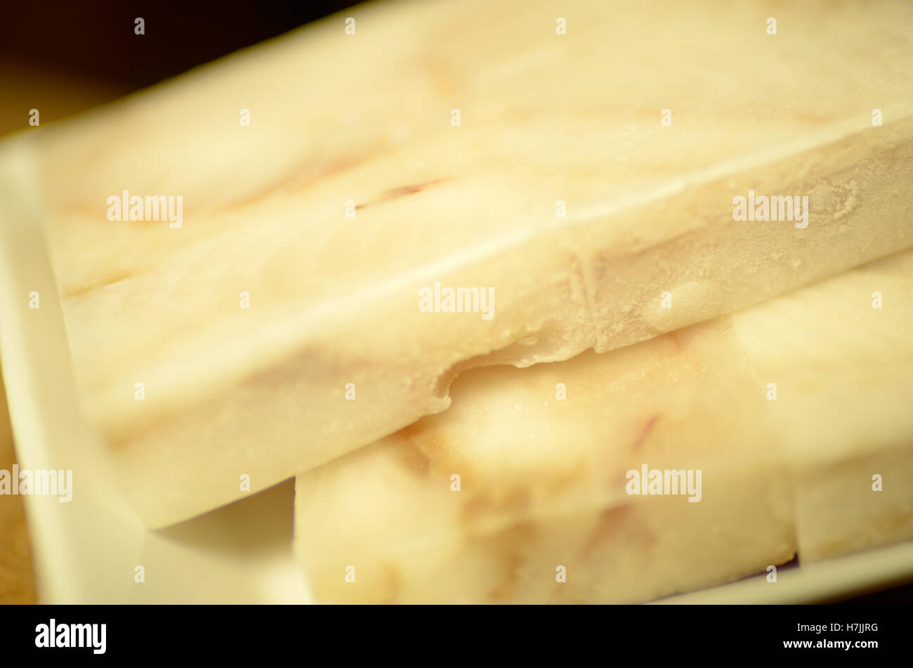 Frozen pollock fillets on a plate, ready for preparation Stock Photo ...