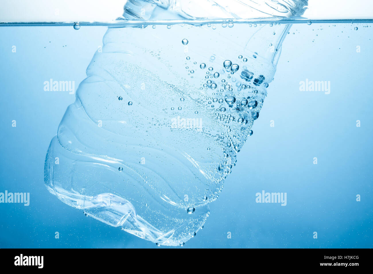 Bottle in under clean drinking water Stock Photo - Alamy