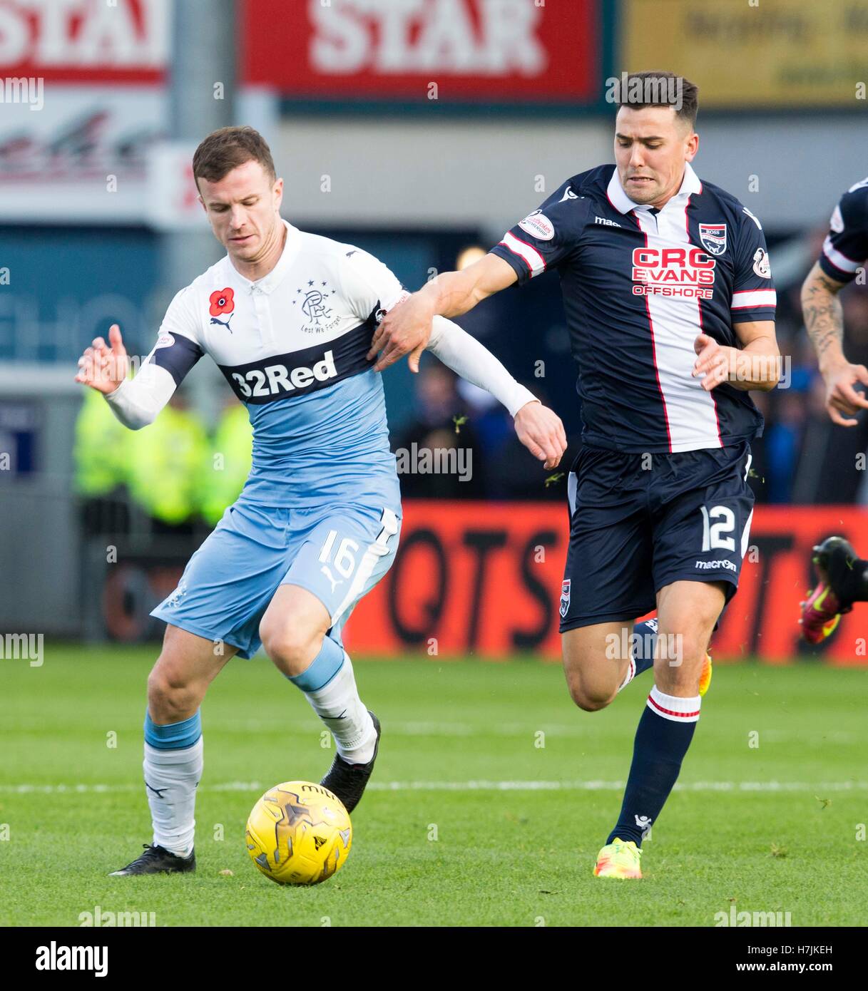 Rangers' Andy Halliday and Ross County's Tim Chow battle for the ball ...