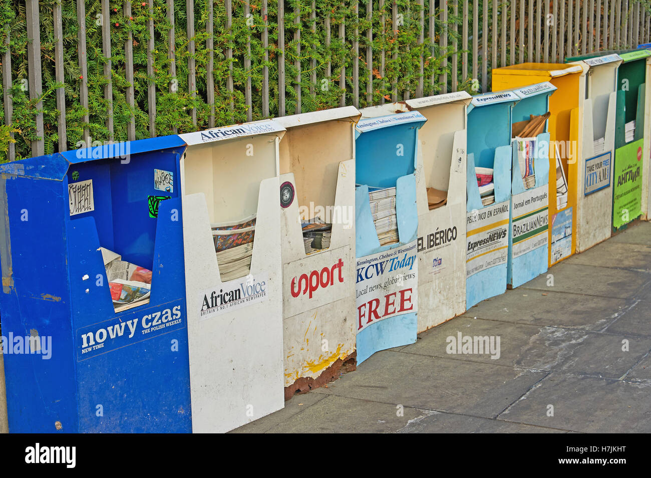 Free newspaper bins in a street in London Stock Photo - Alamy