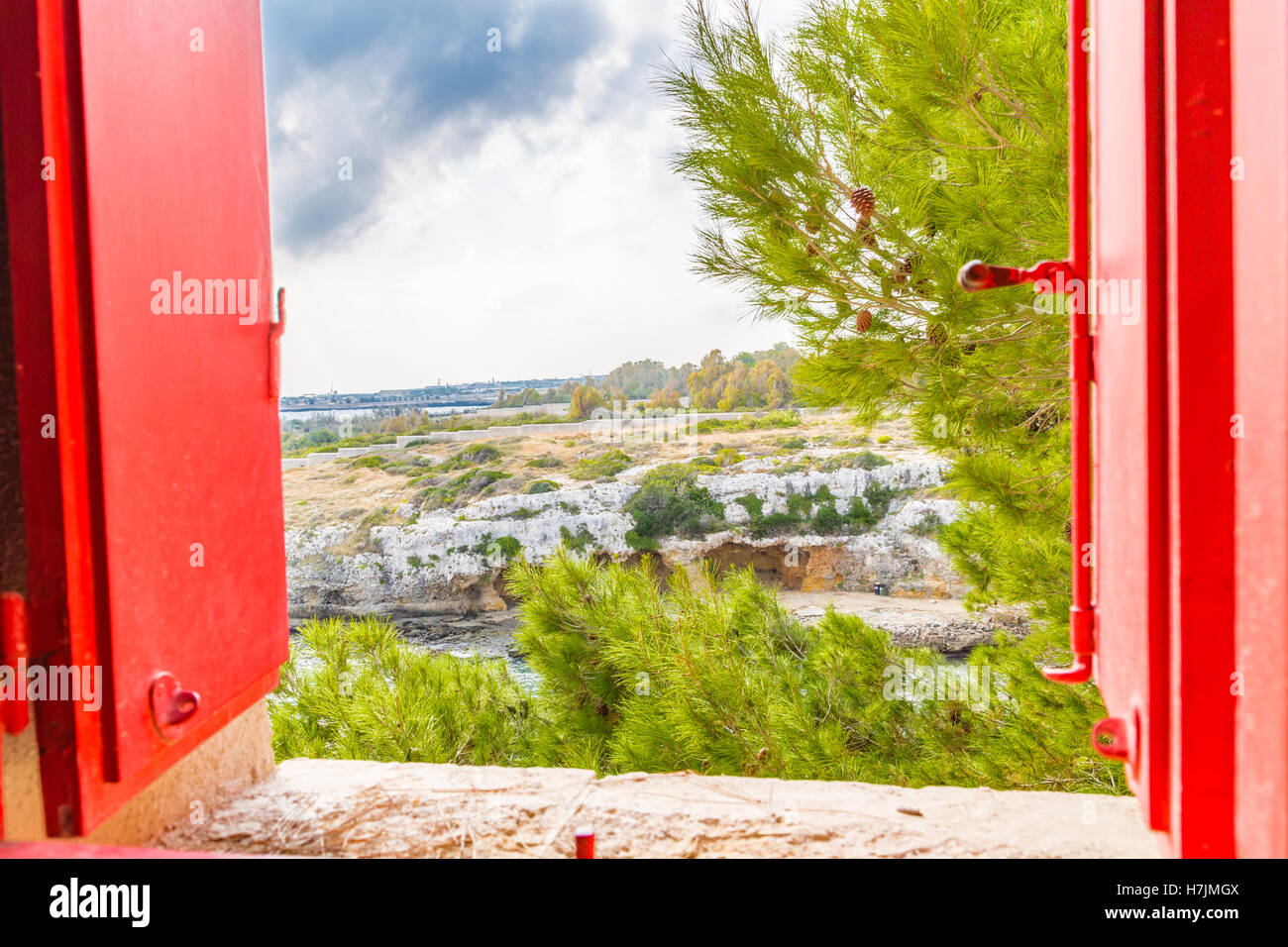 Open window with red shutters overlooking pine forest Stock Photo - Alamy