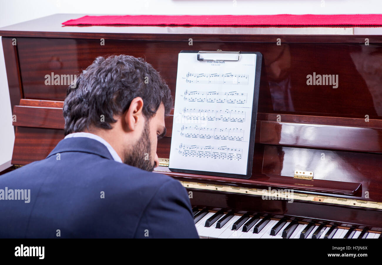 Asian Man Sitting Piano Stock Photos & Asian Man Sitting Piano Stock ...