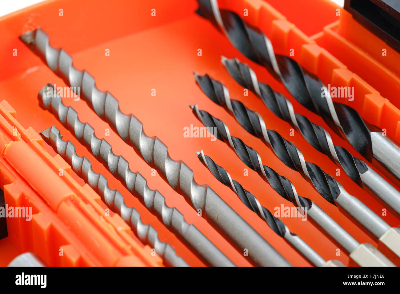 Drill bit set in box isolated on white background Stock Photo - Alamy