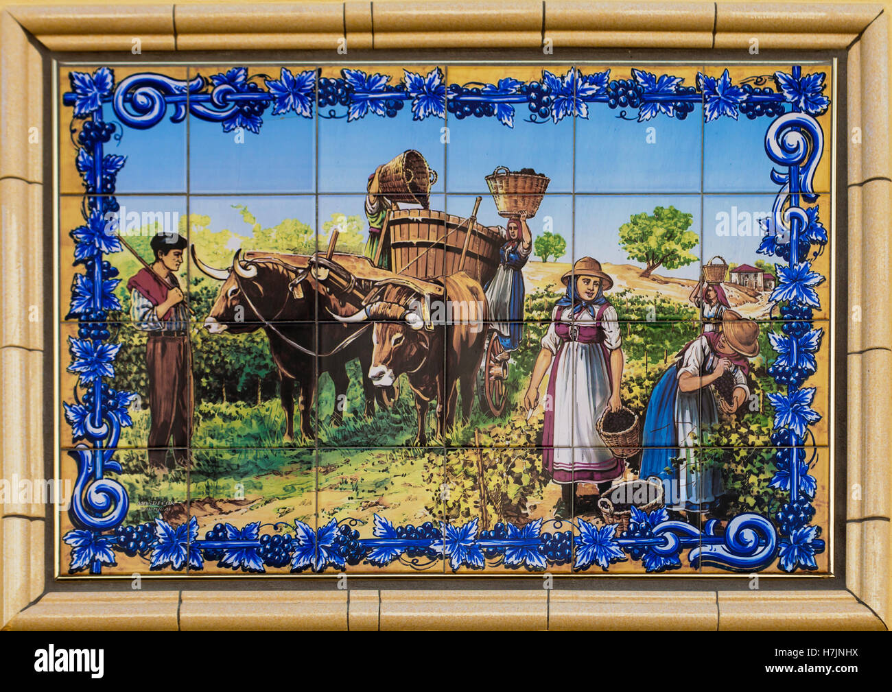 CRUZY, FRANCE - JULY 22, 2015: Artistic tiles depicting village scene ...