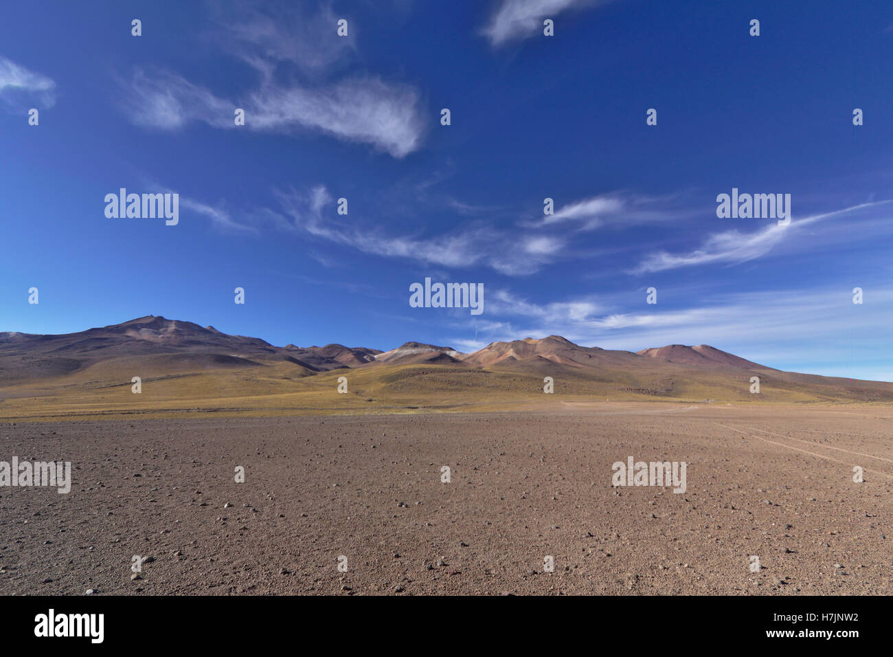 Marvelous desert scenery with volcanic mountains under a gorgeous sky ...