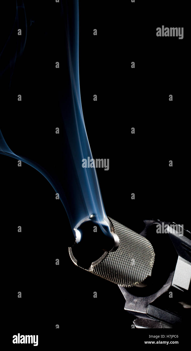 Tall line of smoke coming from a gun on a black background Stock Photo ...