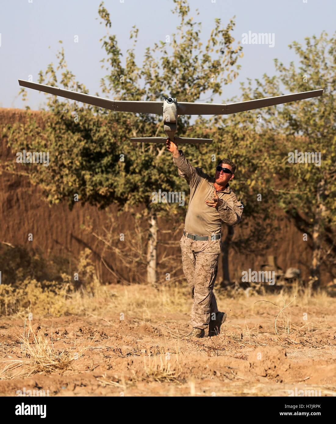 A U.S. soldier hand launches a Puma unmanned aerial vehicle during a ...